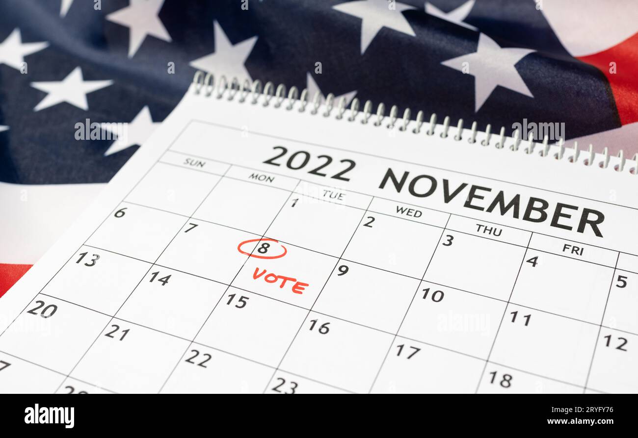 Desk calendar with November 8 2022 marked in red on USA flag background ...