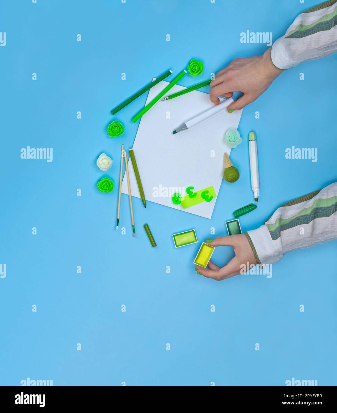 Hands of female artist holding marker. Painter holding a paint marker ...