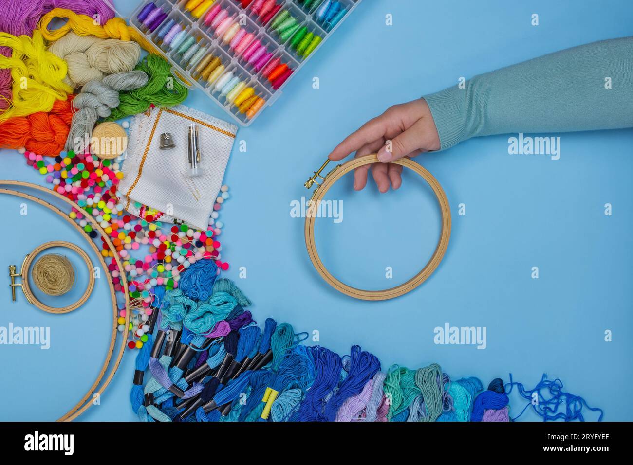 Female hands holding embroidery hoop.Womens hands hold the hoop with ...
