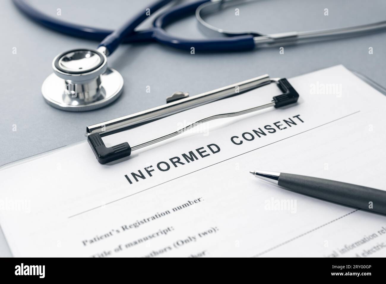 Informed Consent form and stethoscope on desk Stock Photo - Alamy
