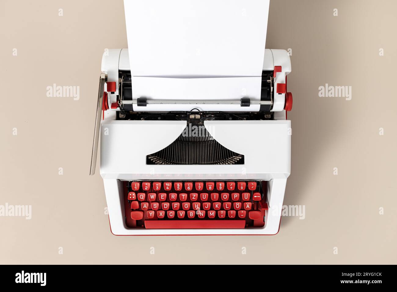 Top view of a retro typewriter with blank white paper. Creative writing ...