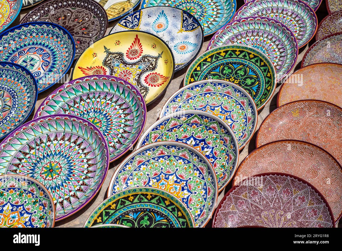 Decorative ceramic plates with traditional uzbek ornament in the street ...