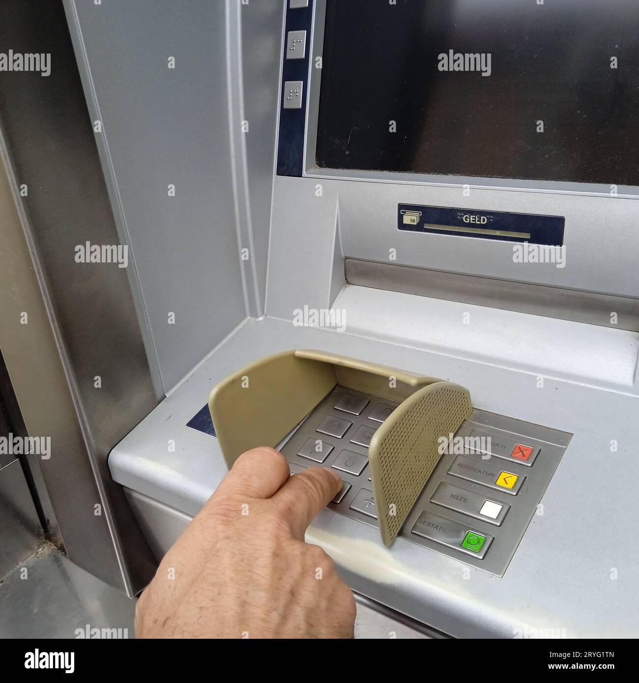 Entering pin code at an ATM Stock Photo - Alamy
