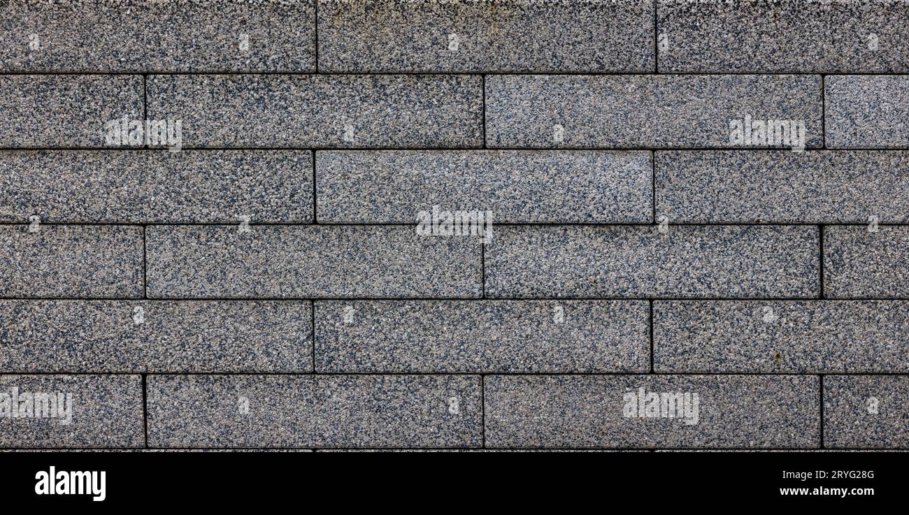 Flat texture and full-frame background of gray long rectangular brick ...