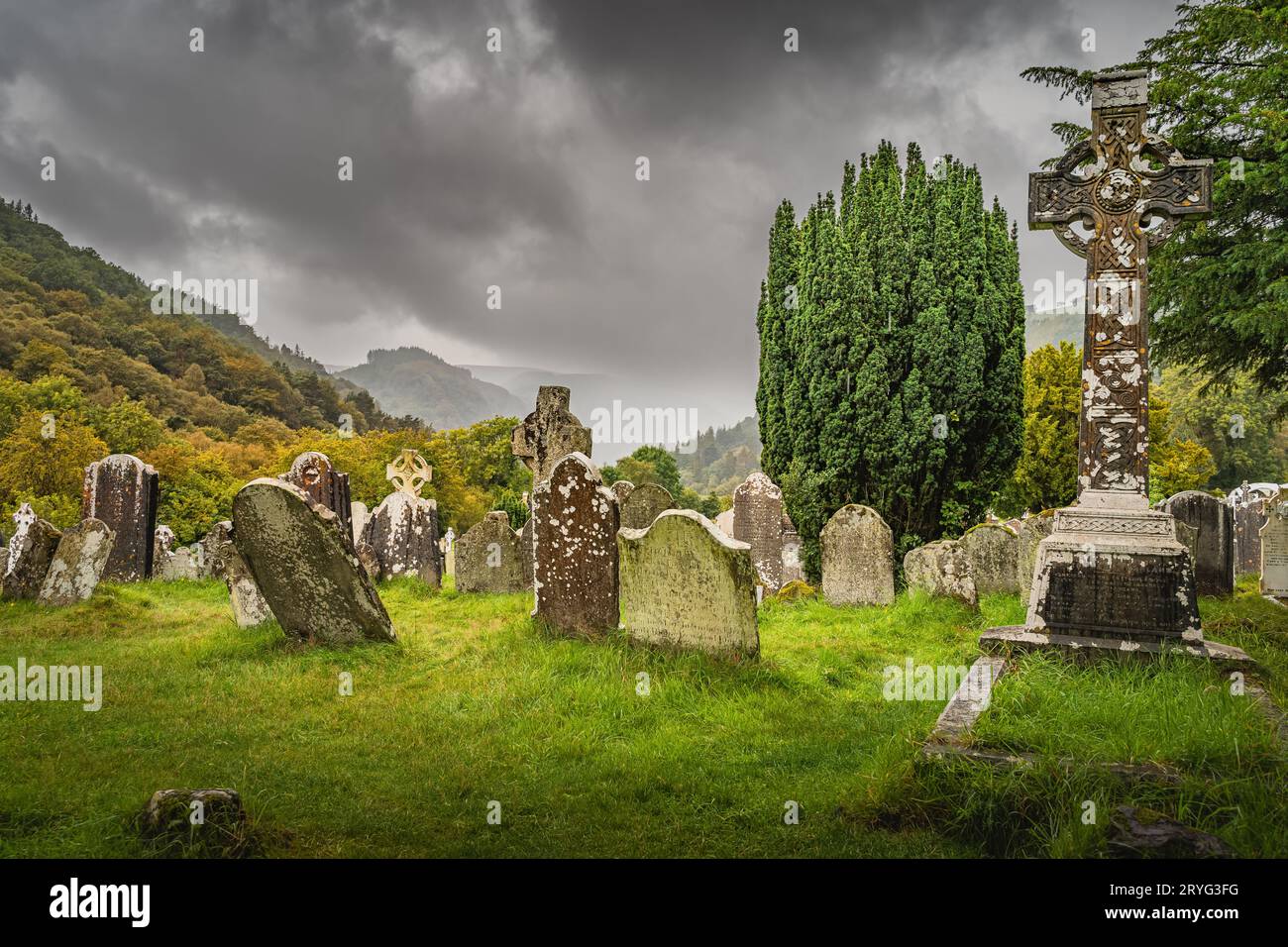 Ancient graves with Celtic crosses in Glendalough Cemetery, Wicklow ...