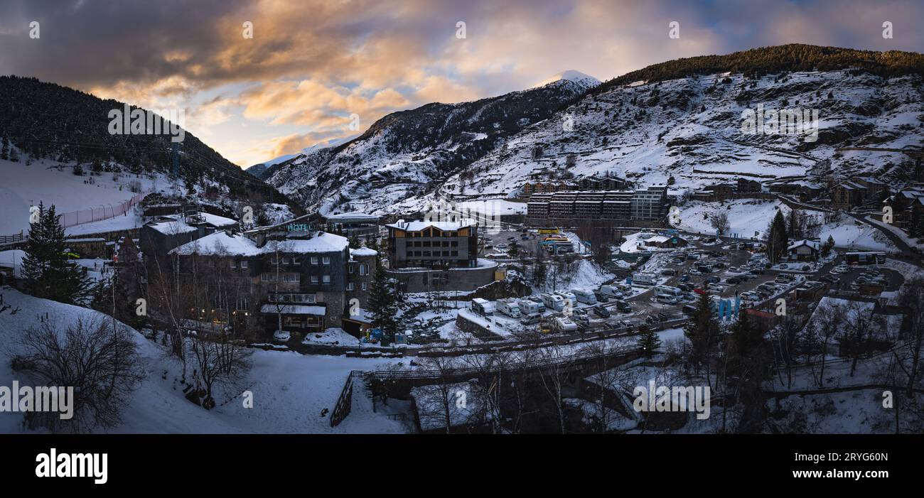 El Tarter village after dusk with last sunlight illuminating mountain ...