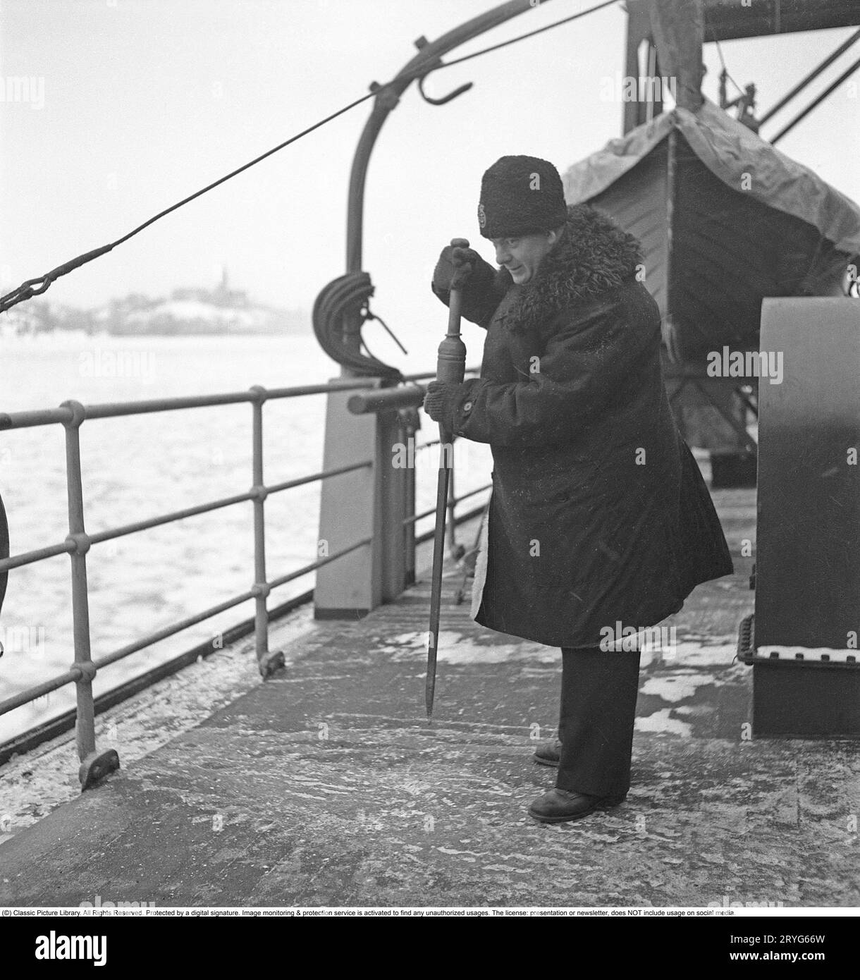 Winter at sea in the 1940s. Pictured a crewmember of the swedish ...