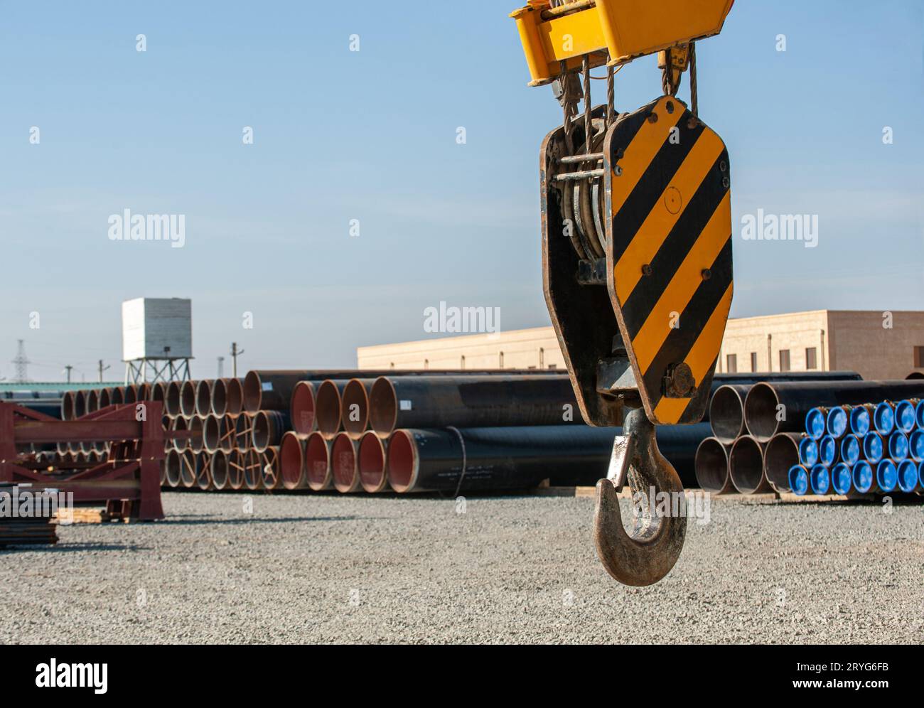 Crane lifting pipes hi-res stock photography and images - Alamy