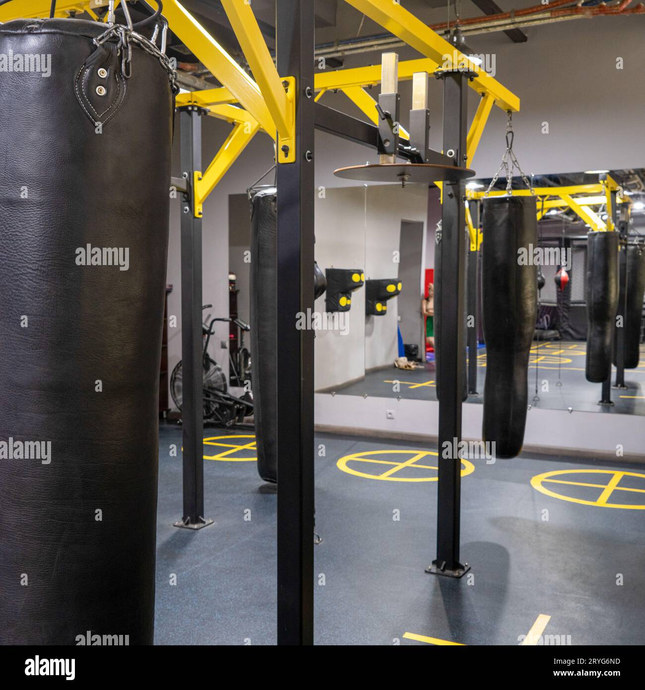 A vertical shot of boxing bags in the sports complex Stock Photo - Alamy