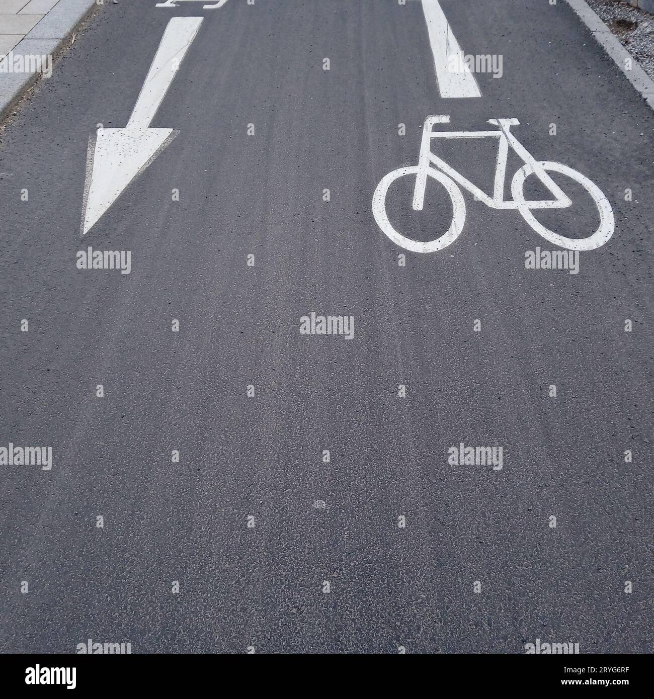 Bicycle path marking on the street Stock Photo - Alamy