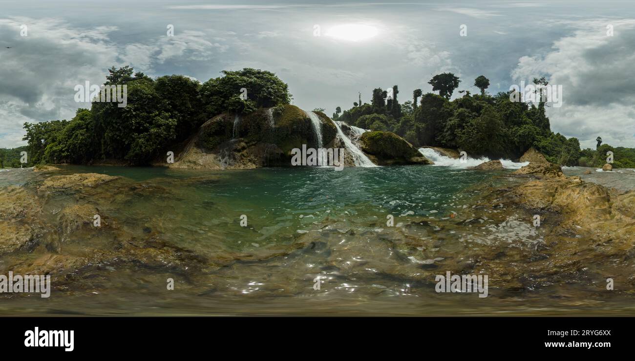 Rapid water flowing over the bedrocks in Aliwagwag Falls. Mindanao ...