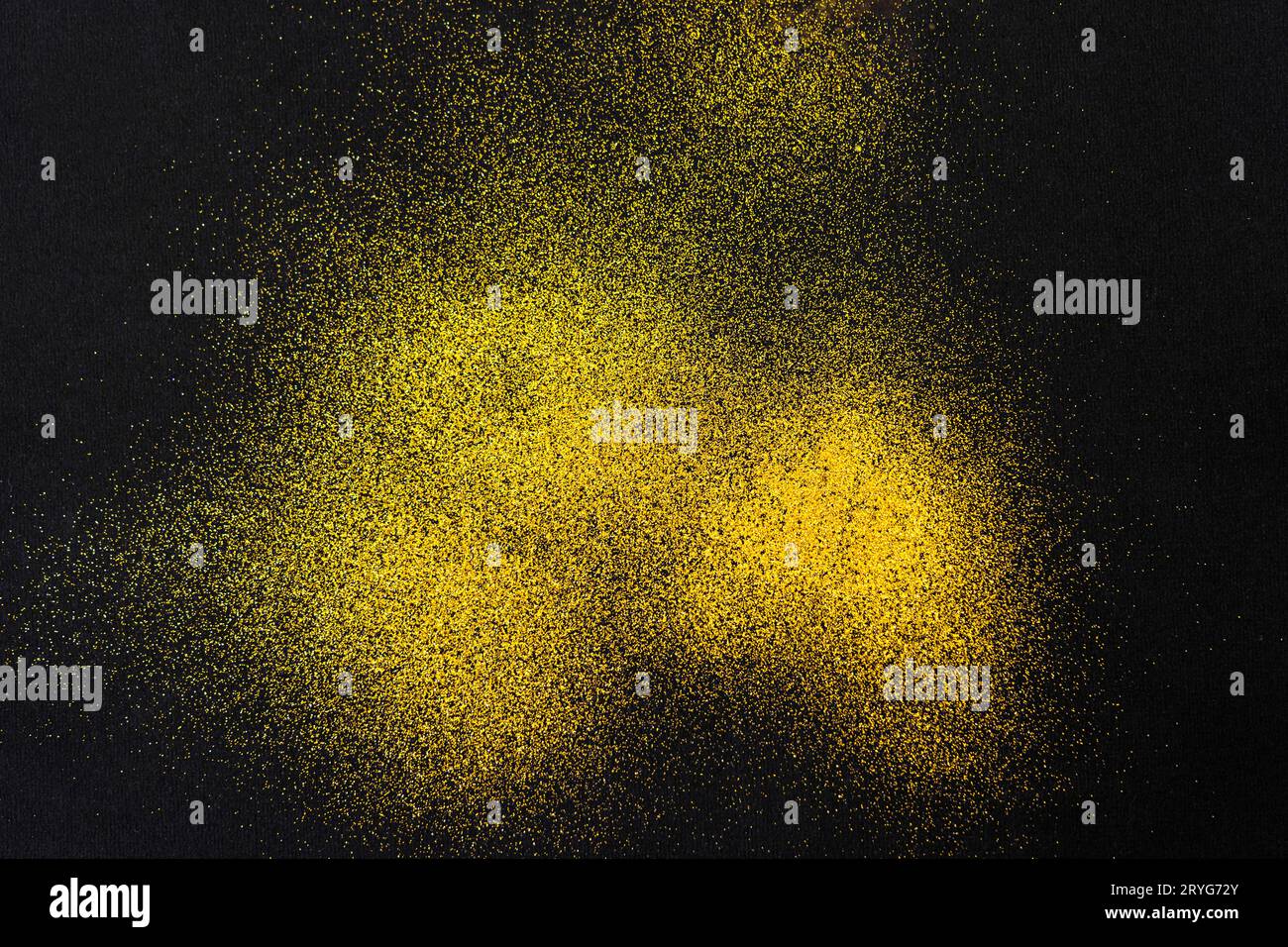 A minimal golden sand texture on a black background Stock Photo - Alamy