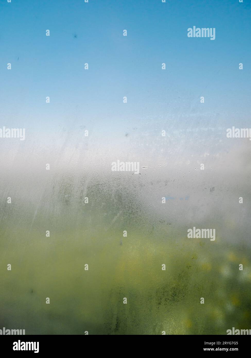Condensation on clear glass window in bathroom. Water drops and ...