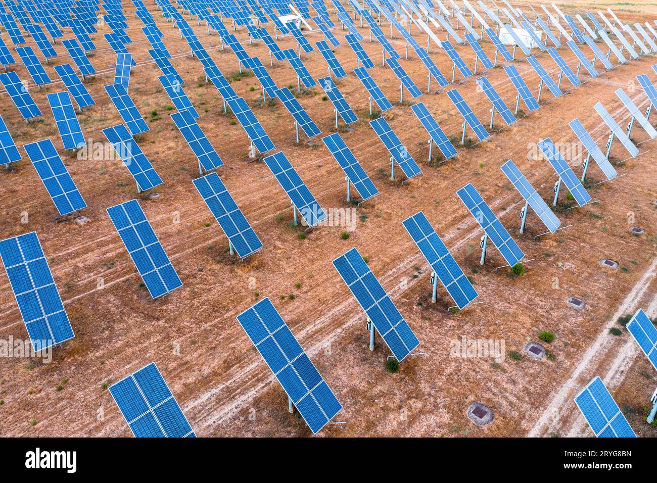 Aerial view of a solar power station and solar energy panels in a rural ...