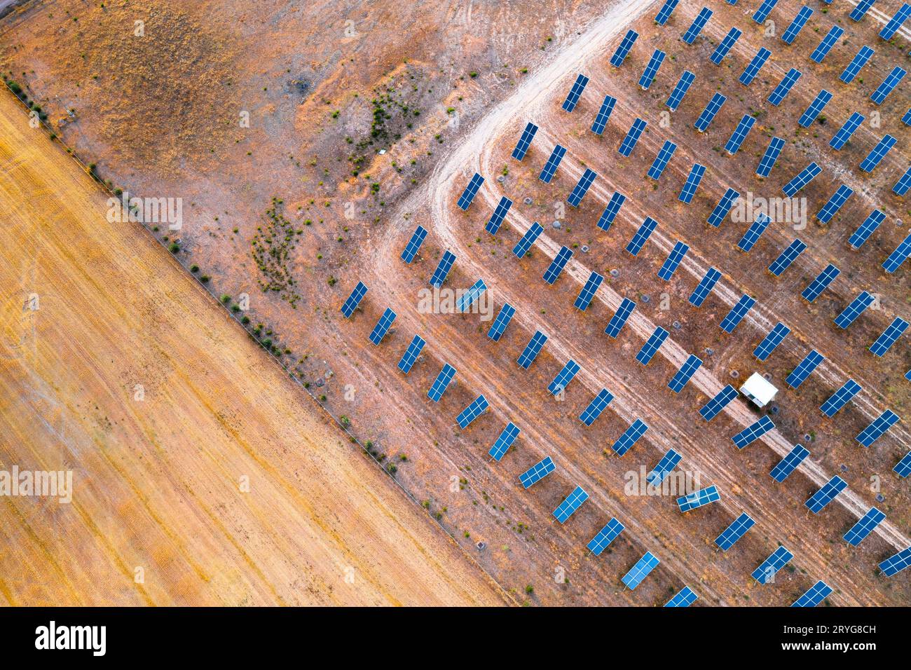 Aerial view of a solar power station and solar energy panels in a rural ...
