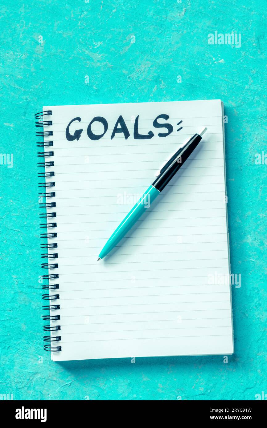 Goal Setting. Handwritten word Goals with a ballpoint pen and a notepad ...