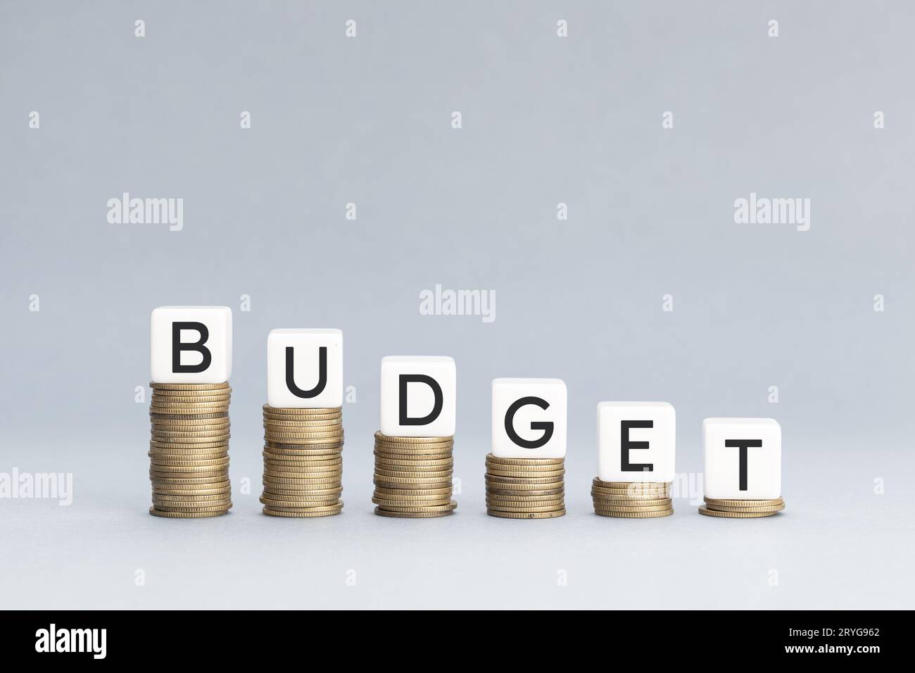 Constraint budget concept. Pile of coins forming a descending graph ...