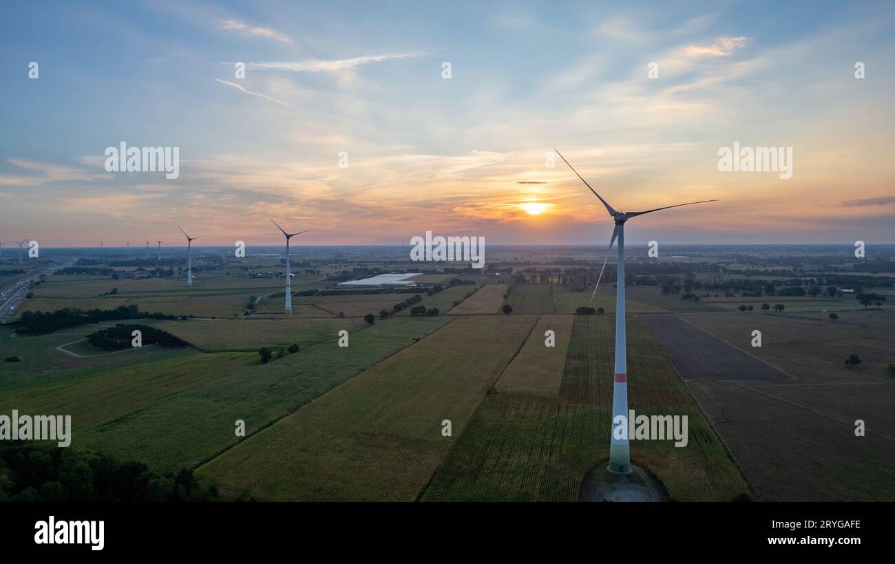 Beautiful wind turbine in the countryside in the time of sunset ...