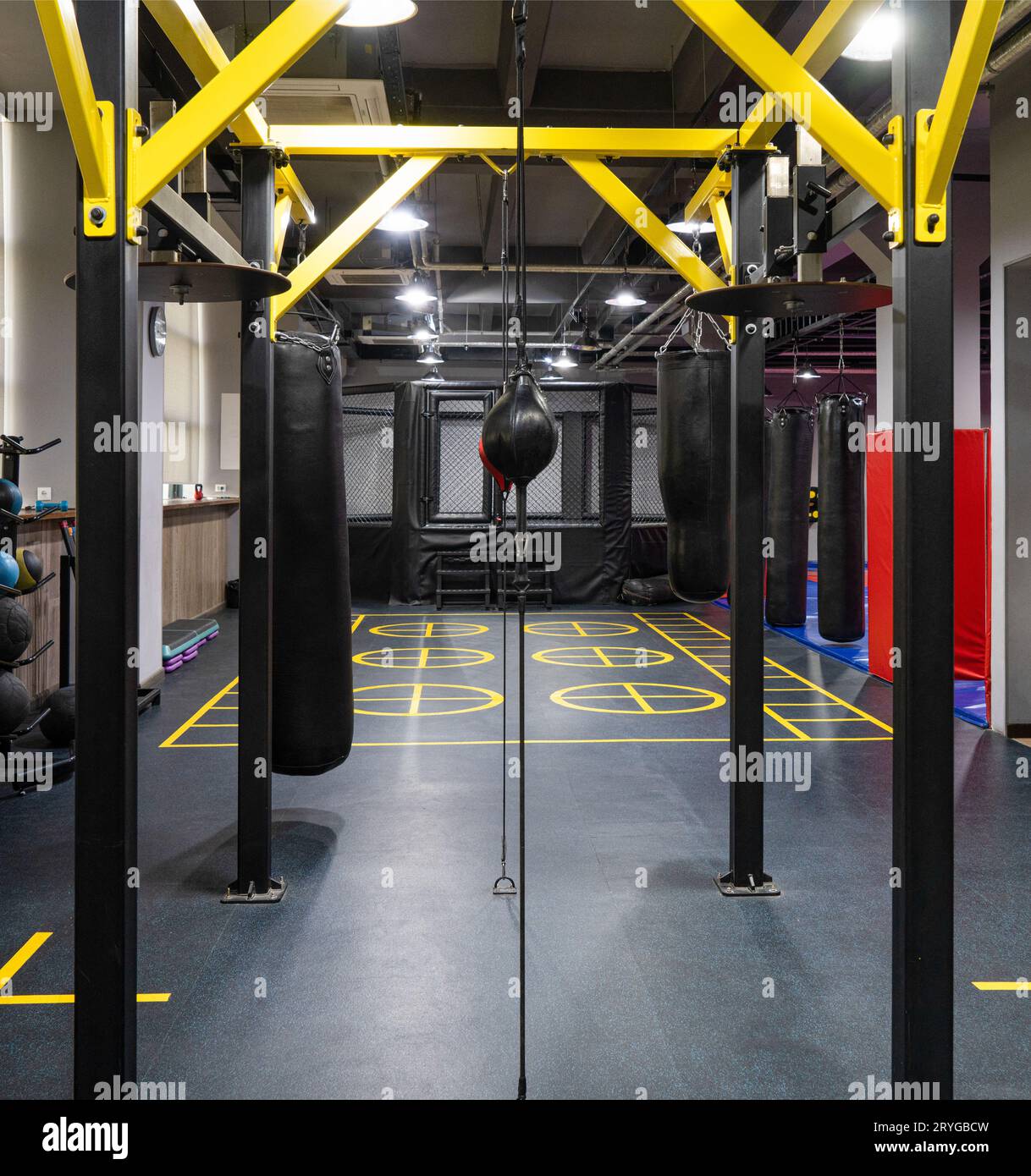 A vertical shot of boxing bags in the sports complex Stock Photo - Alamy