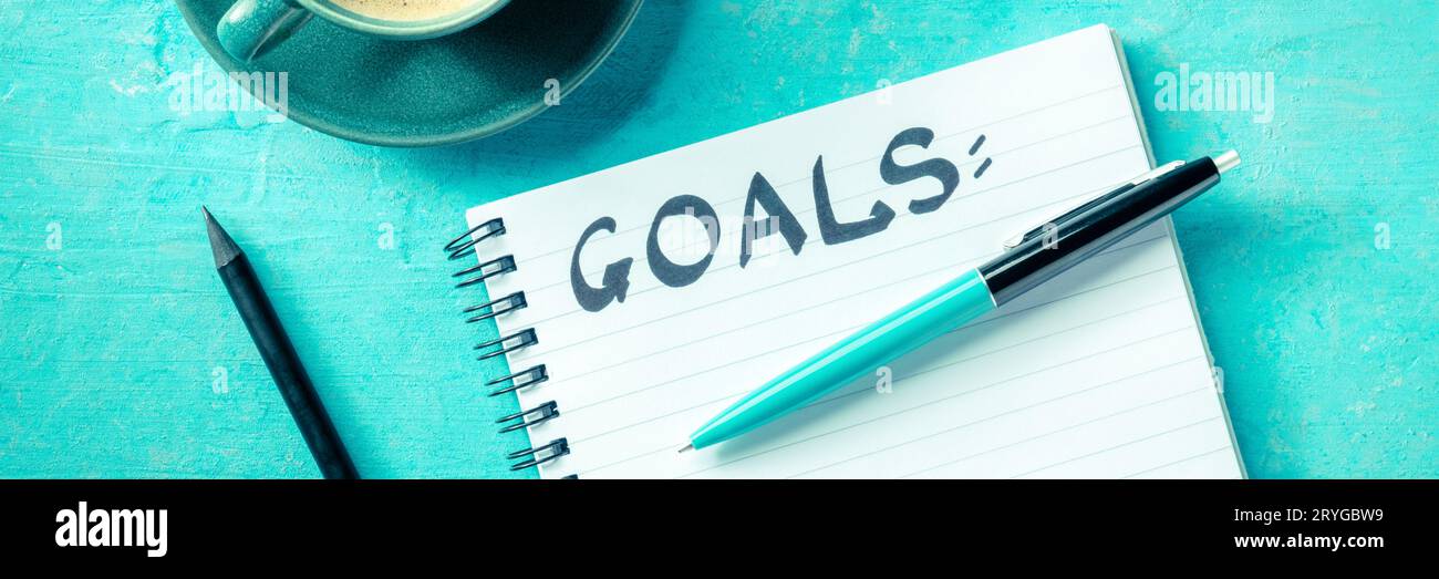 Goal Setting concept. A top shot of a notepad with the handwritten word ...