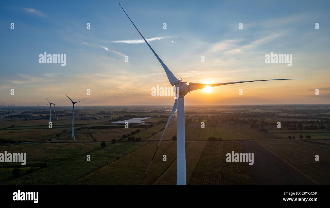 Beautiful wind turbine in the countryside in the time of sunset ...