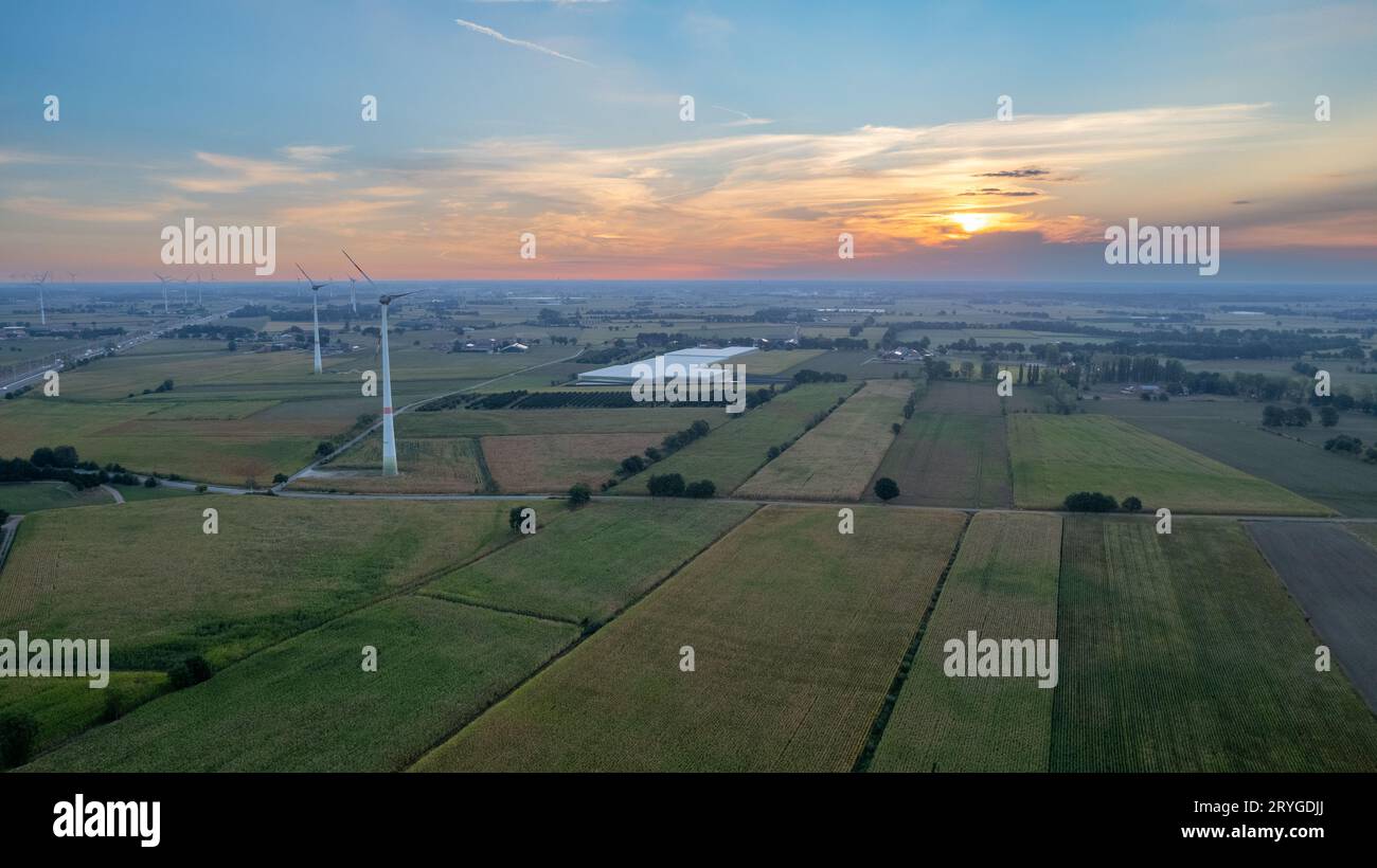 Beautiful wind turbine in the countryside in the time of sunset ...