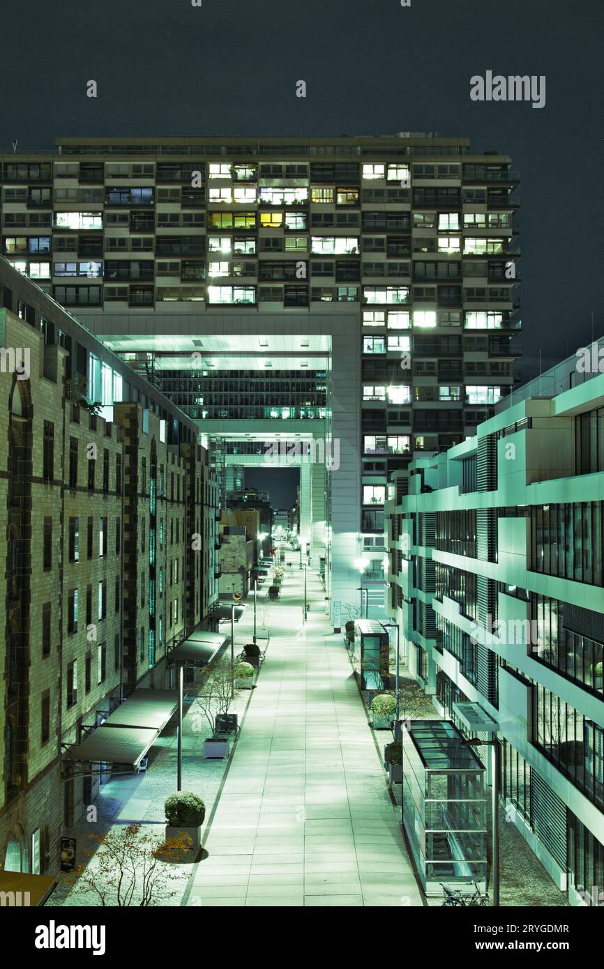 Zollhafen Street below and through the crane houses at night in Cologne ...