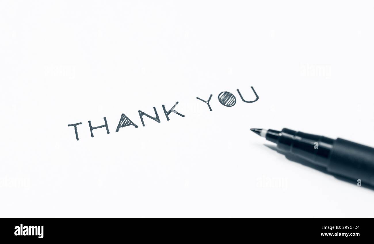 Thank you phrase made with stencil letters on white paper background ...