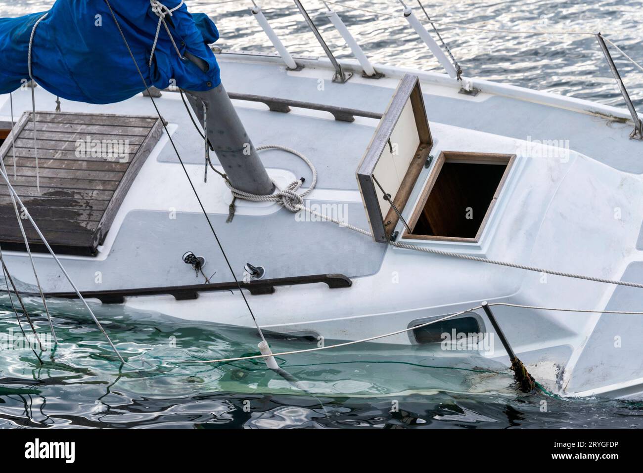 White yacht drowned in Pacific Ocean bay Stock Photo - Alamy
