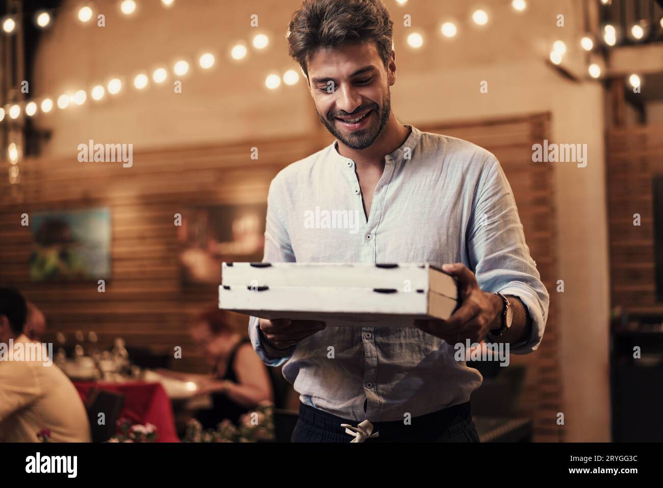 Handsome young man walking restaurant hi-res stock photography and ...