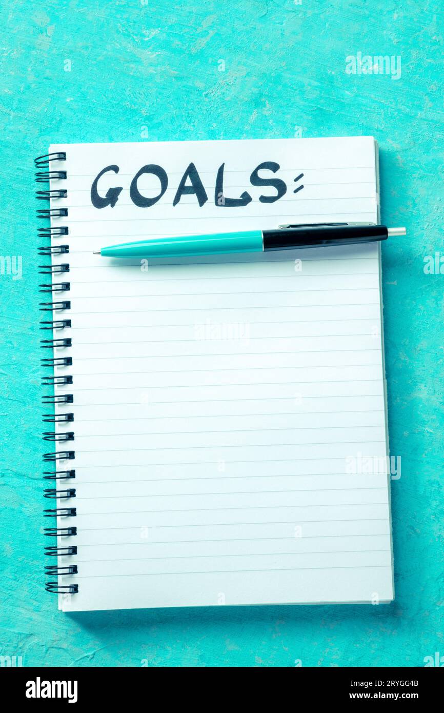 Goal Setting concept. Handwritten word Goals with a pen and a paper ...