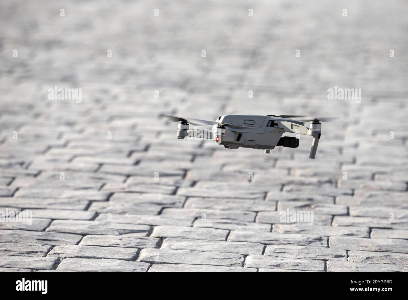 Drone landing, hovering above the tiles outdoor Stock Photo - Alamy