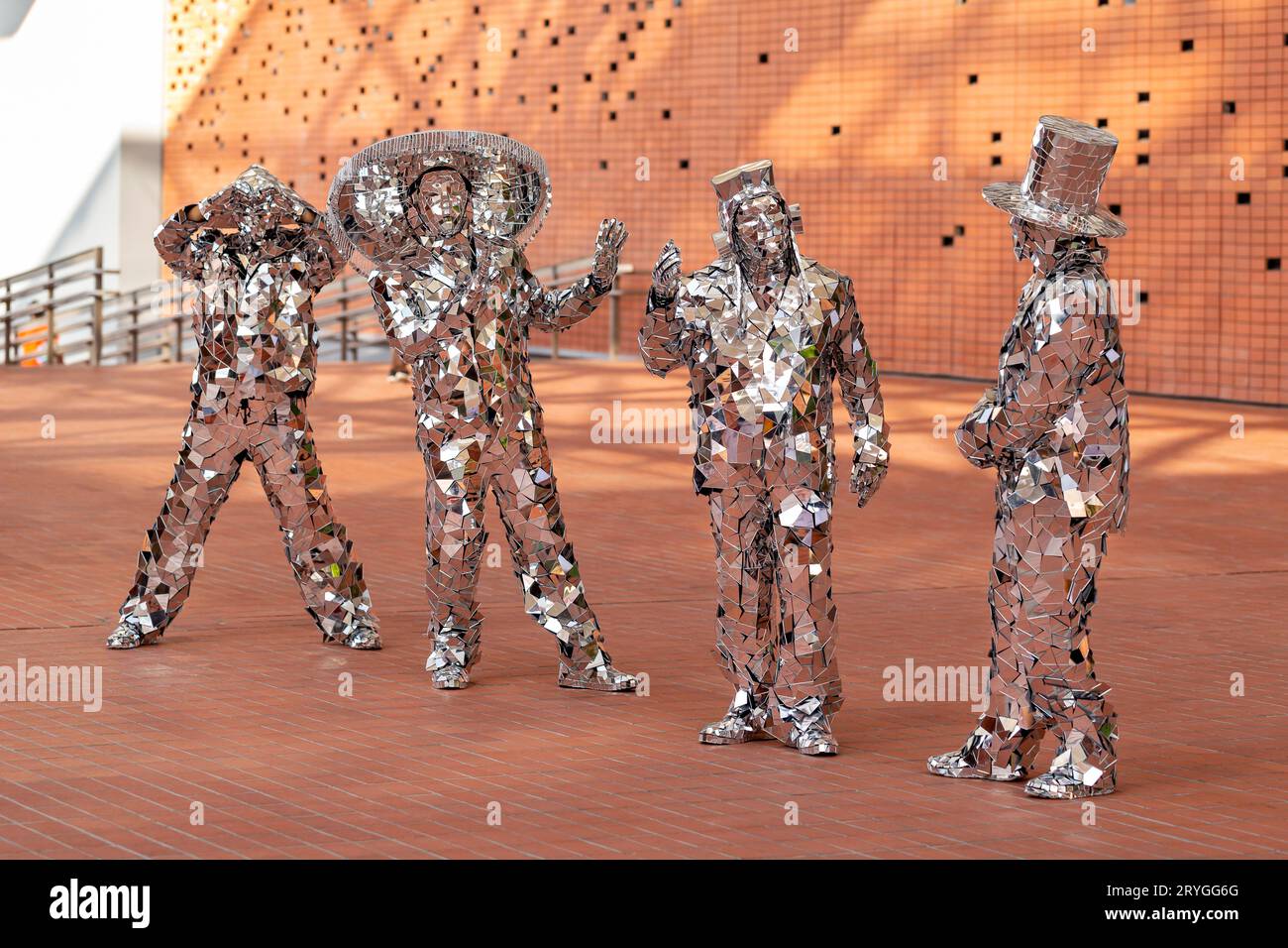 Dubai, UAE - November 4, 2021: Performers in mirror costumes posing at ...