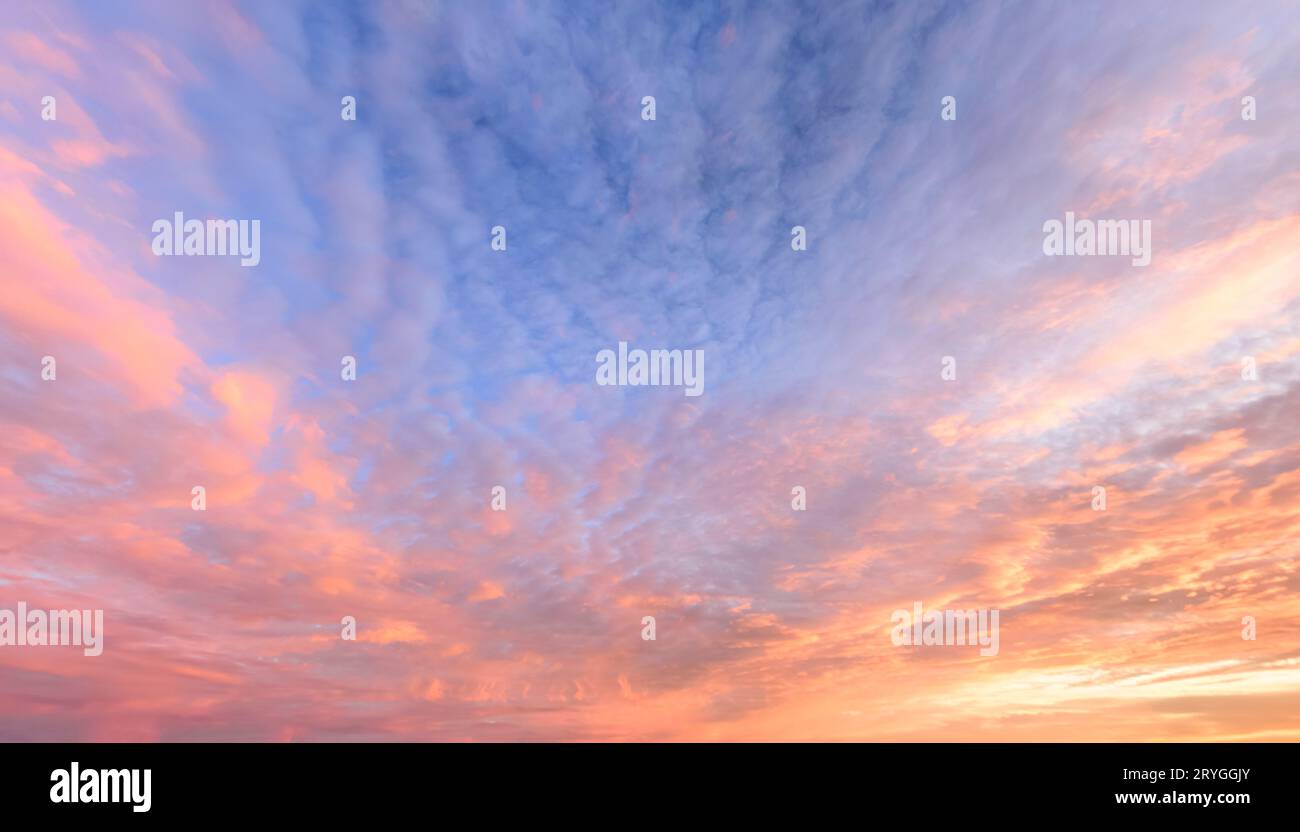 Wild, fiery evening sky with clouds just before sunset Stock Photo - Alamy