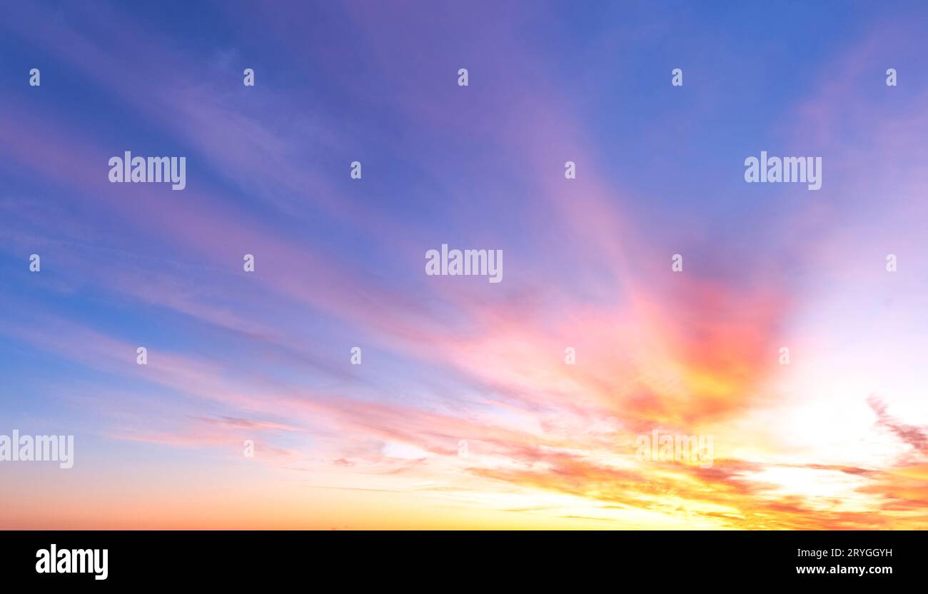 Wild, fiery evening sky with clouds just before sunset Stock Photo - Alamy