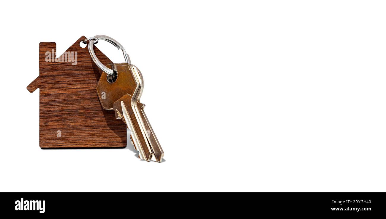 Home keys in a house-shaped keyring isolated on a white background ...