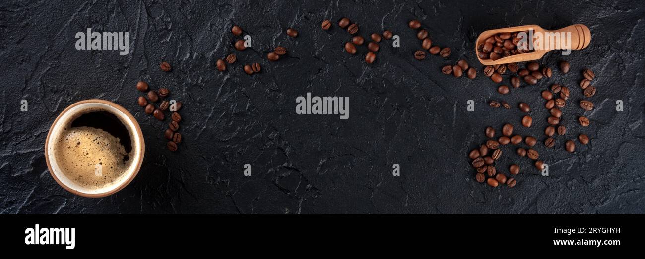 Coffee cup and beans panorama, overhead flat lay shot on a black ...