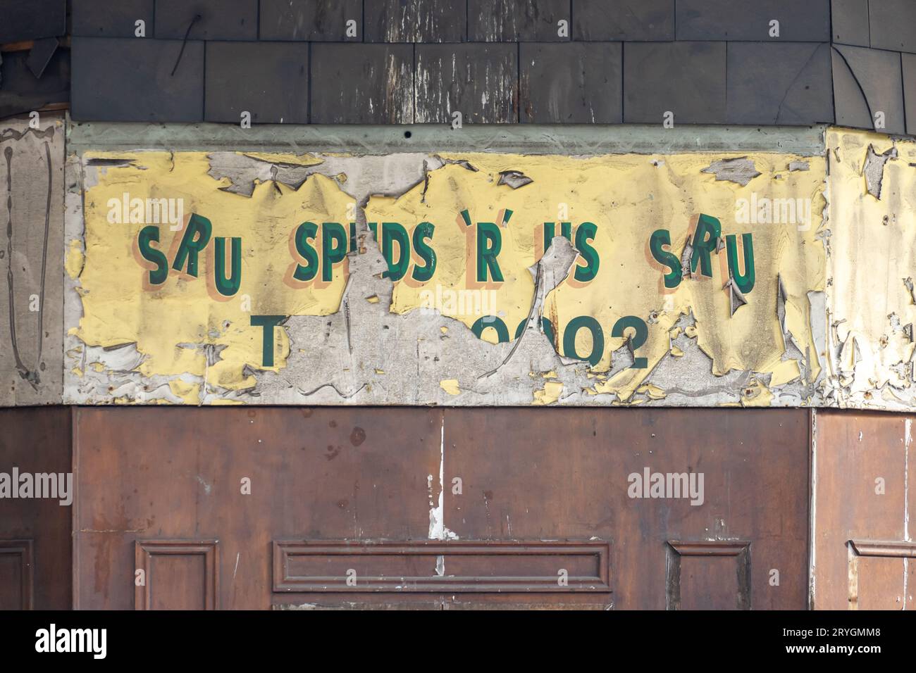 A closed down shop, in a run down area in the town centre of ...