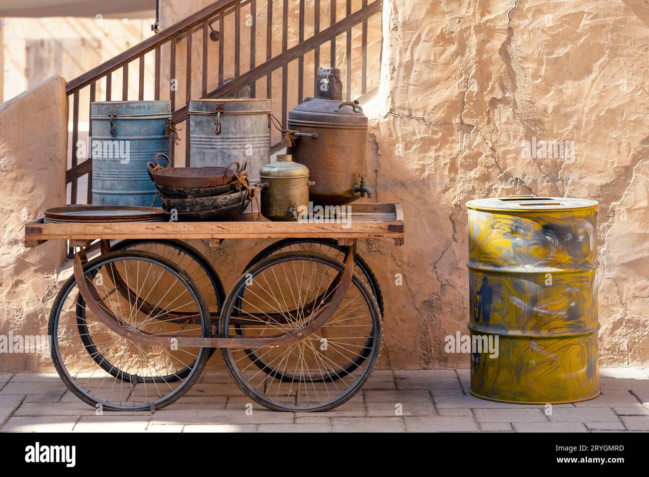 Rusty vintage kitchenware on a wheeled wagon, UAE heritage Stock Photo ...