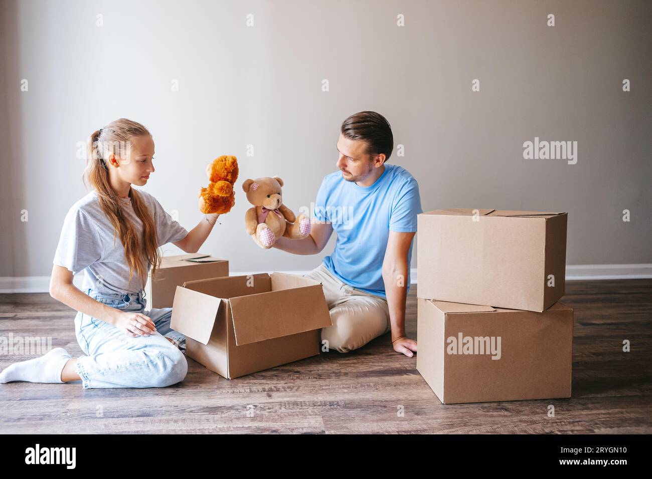 Family of dad and his teen girl have fun in their new home with ...