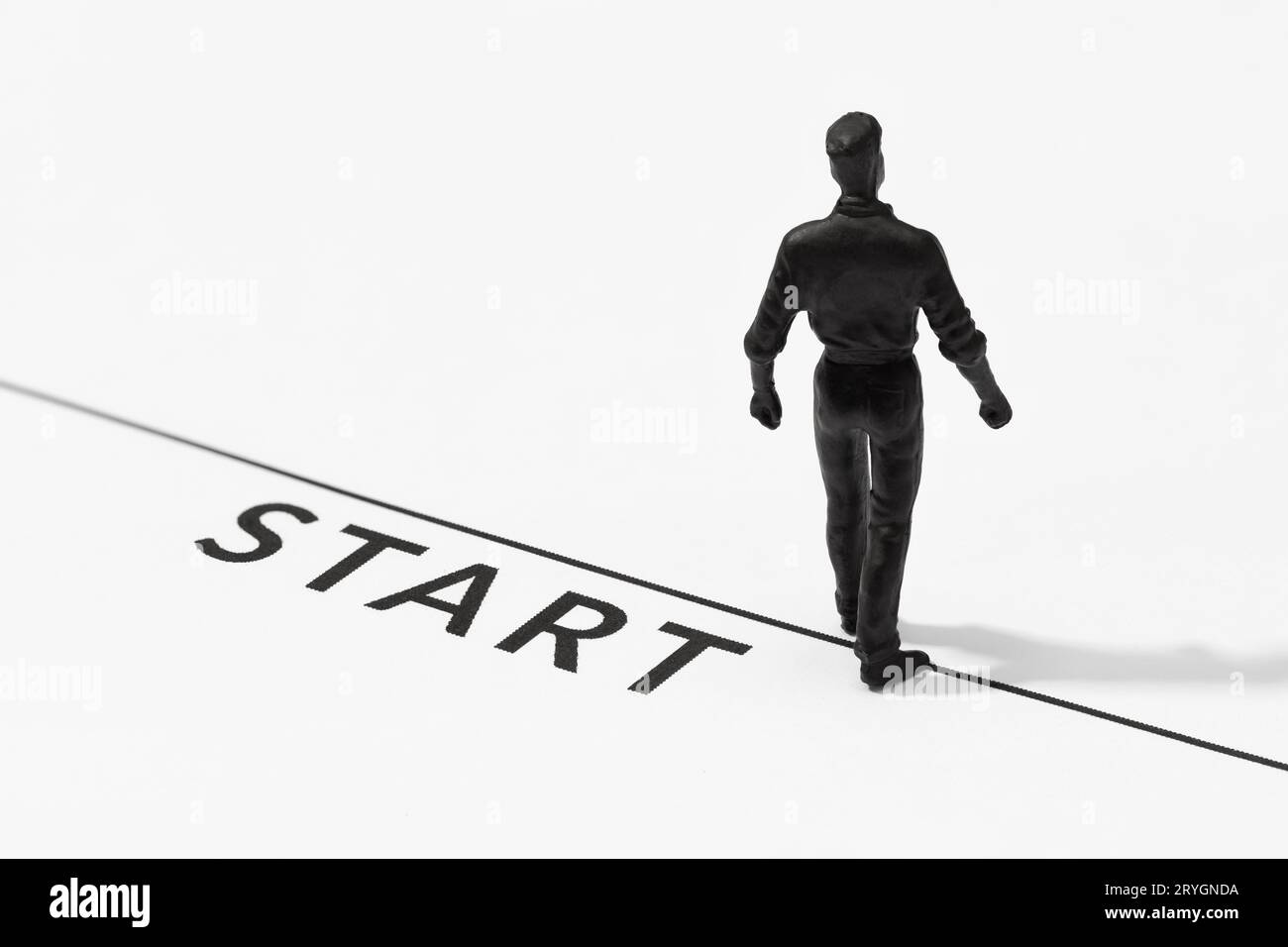 Human figurine walking on the start line. Concept of new year, career ...