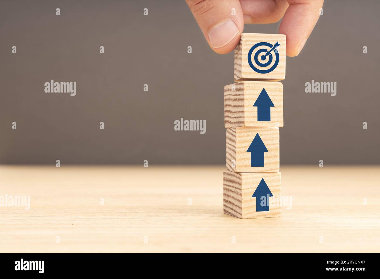 Business goal and objective target concept. Hand holding a cube with ...