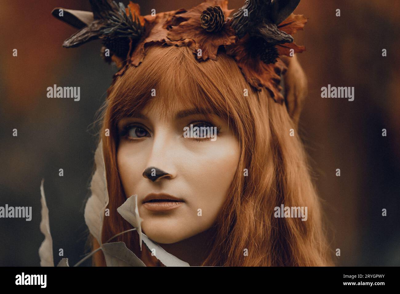 fairy woman with deer horns in autumn forest. Face painting. Beautiful ...
