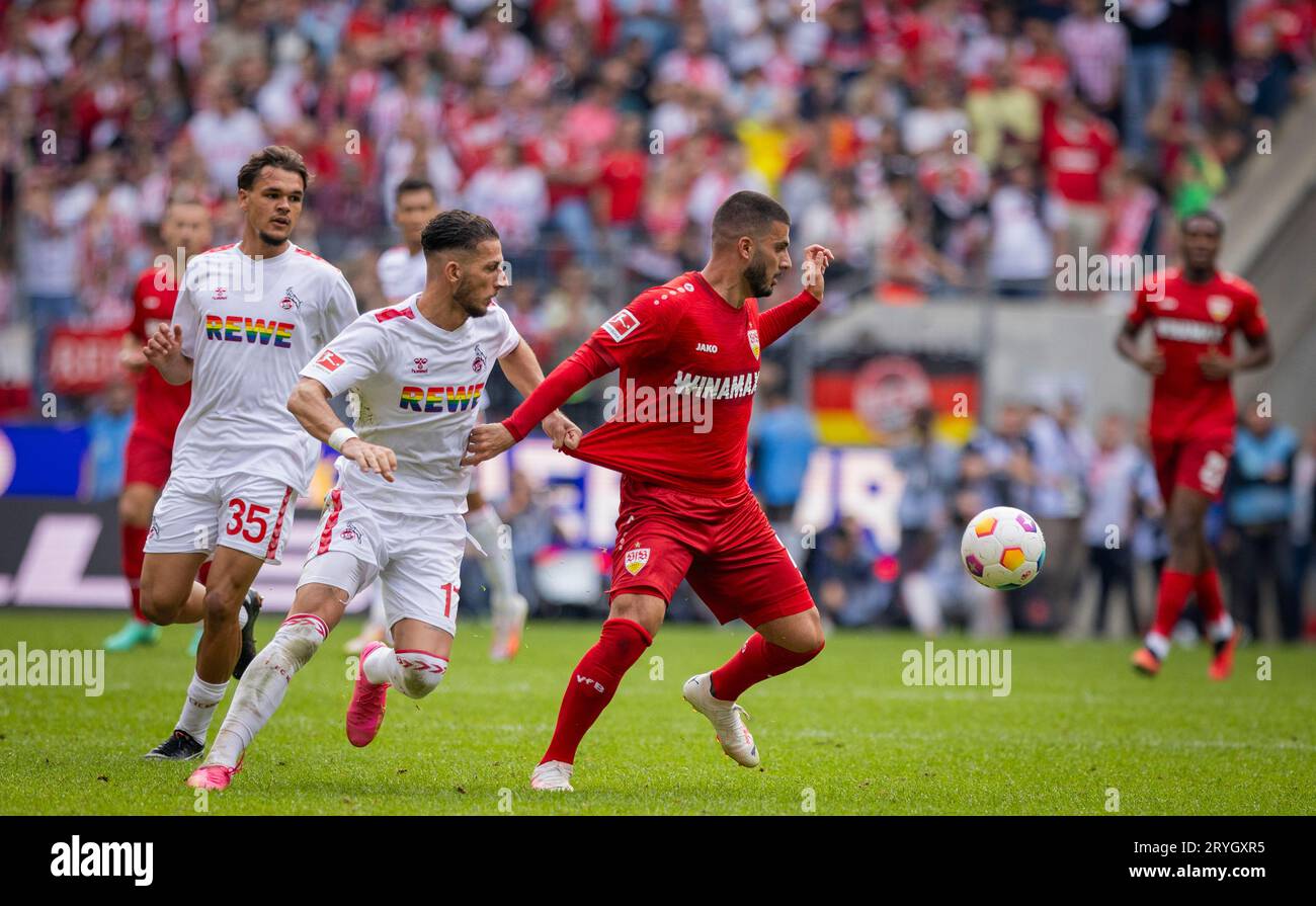 Cologne, Germany. 30th Sep 2023. Leart Paqarada (Köln) Deniz Undav (VfB) 1. FC Köln - VfB ...
