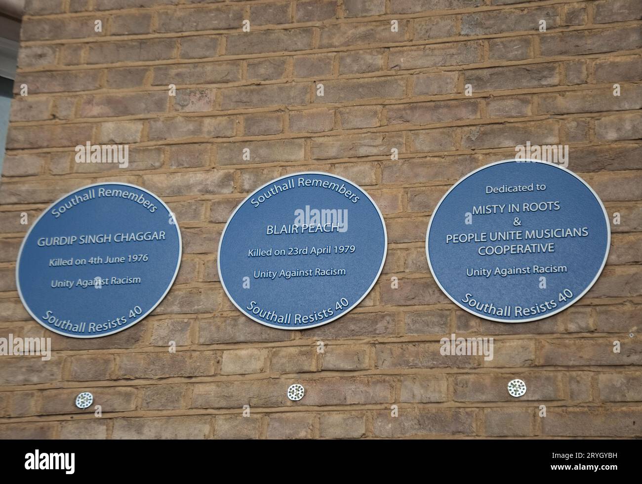 Unity against Racism; - plaques commemorating two people who died: one ...