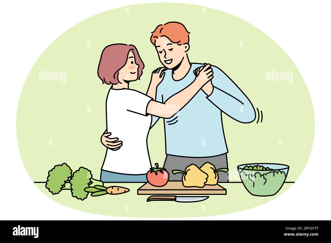 Happy couple cooking in kitchen dancing together. Smiling man and woman ...