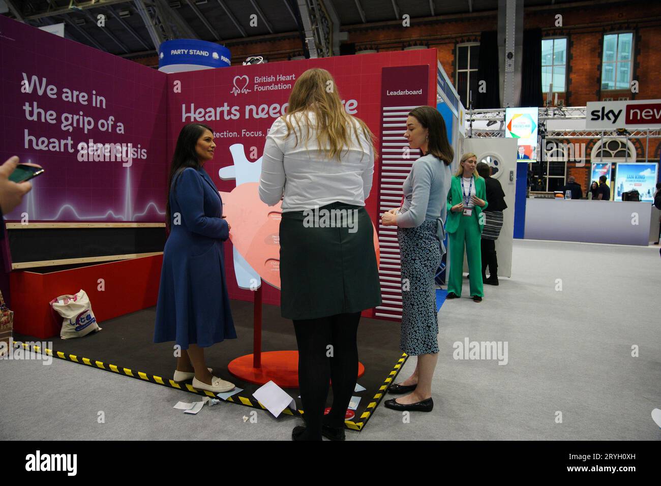 Former home secretary Dame Priti Patel (left), speaks with stall ...