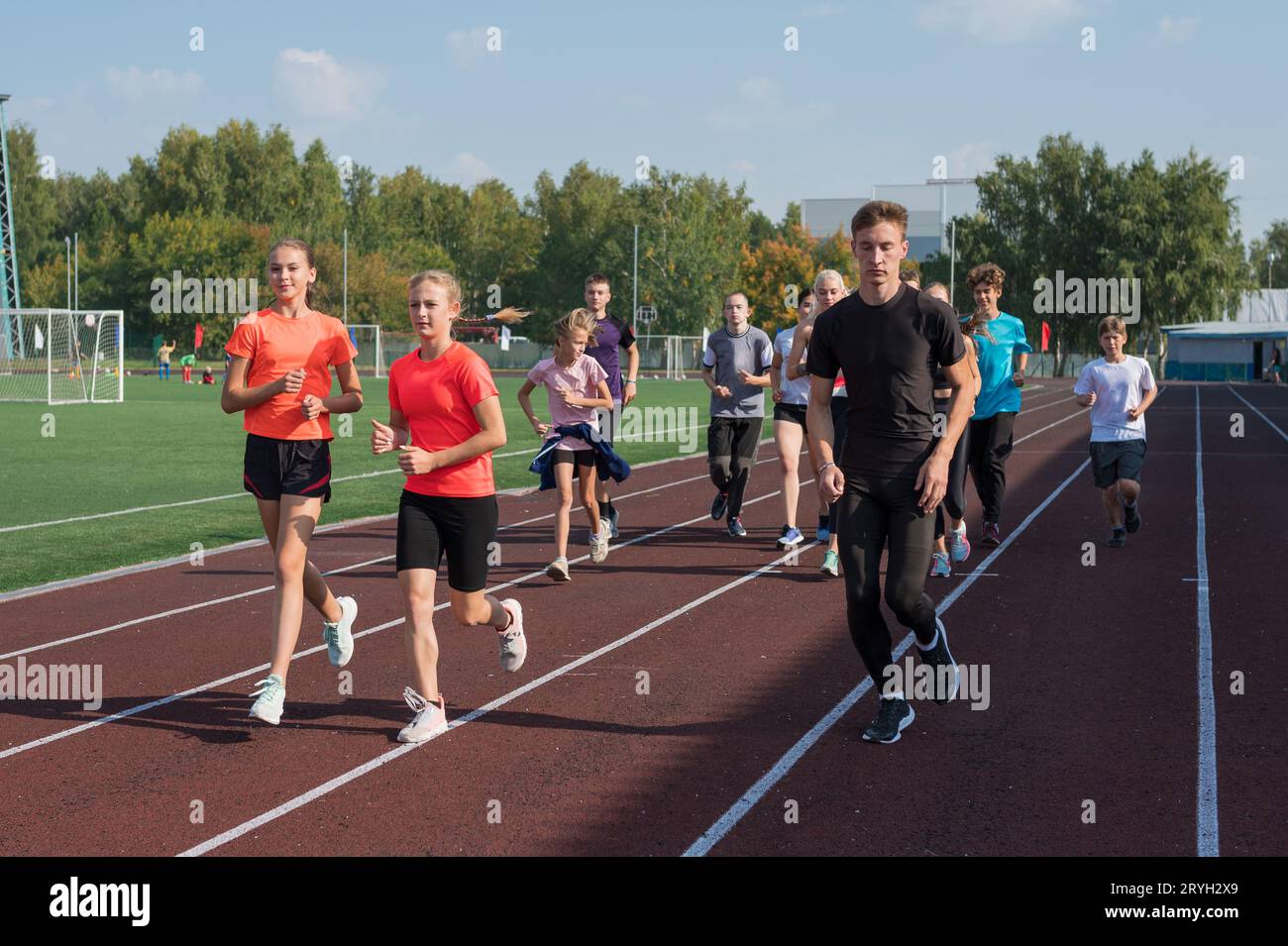 Group of young athletes training at the stadium Stock Photo - Alamy