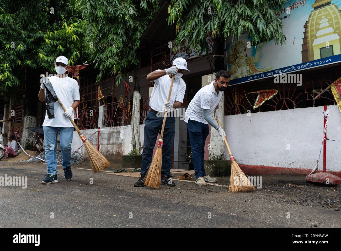 Volunteers of Indian Oil Corporation cleans garbage near a road as they ...