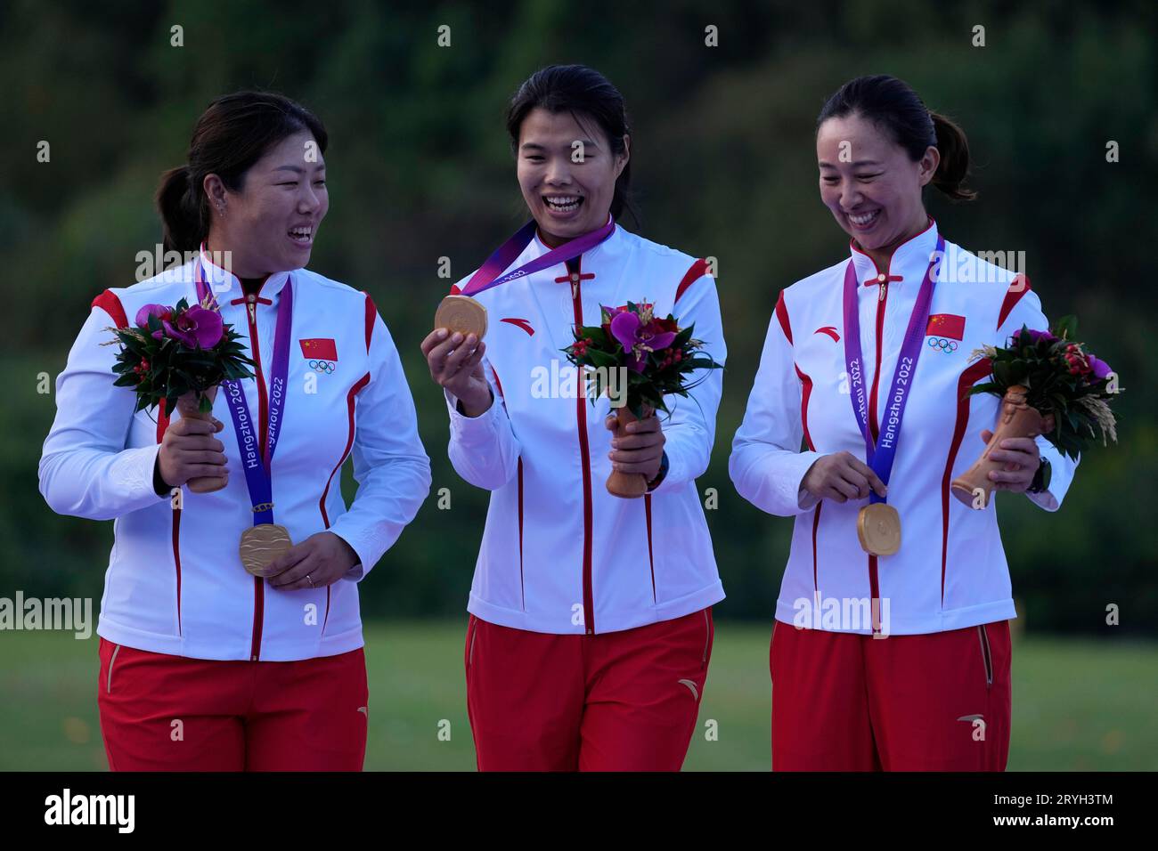 From left, China's Wu Cuicui, Zhang Xinqiu and Li Qingnian celebrate ...